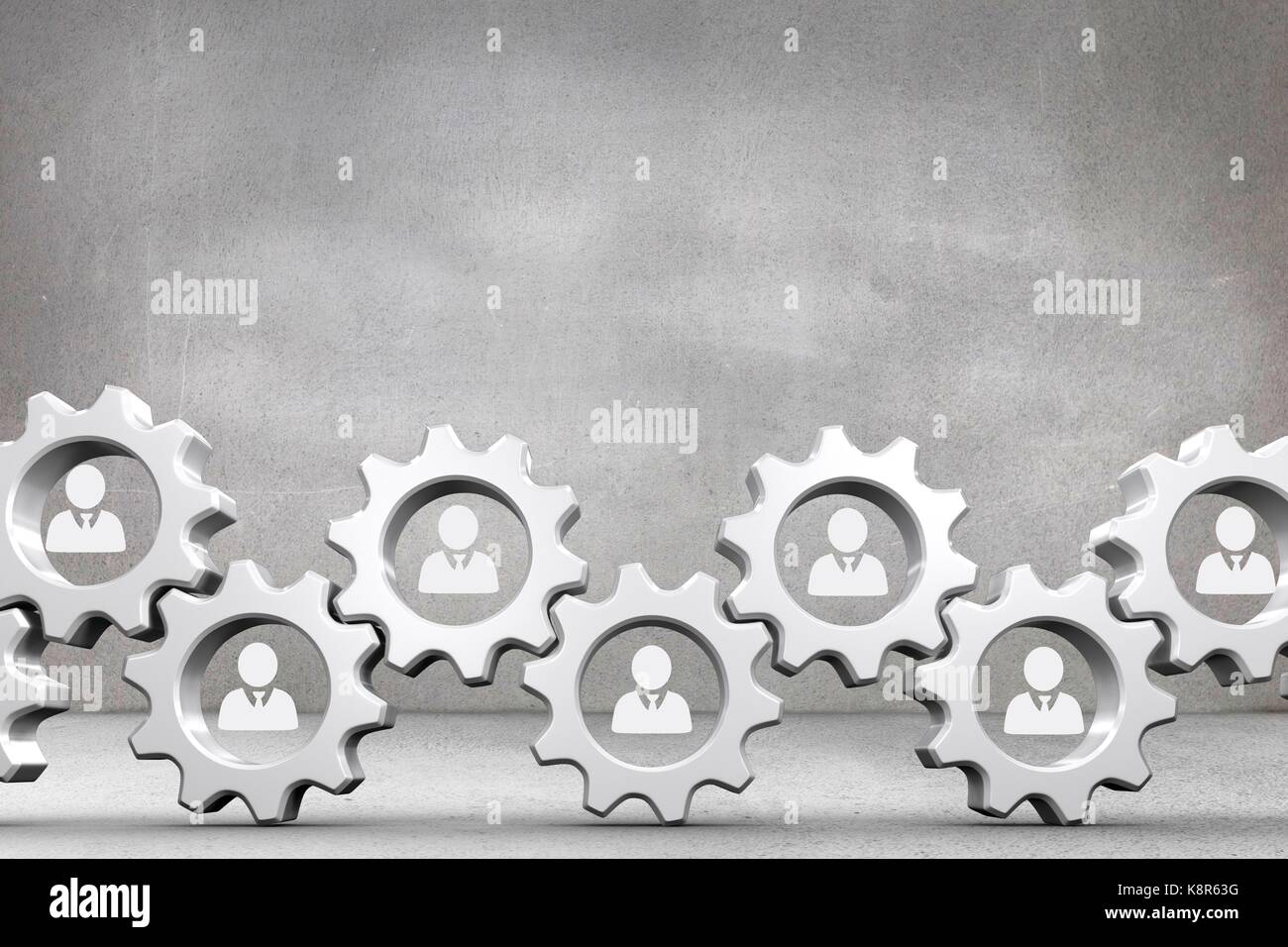 Digital composite of People in cogs graphics against grey background ...