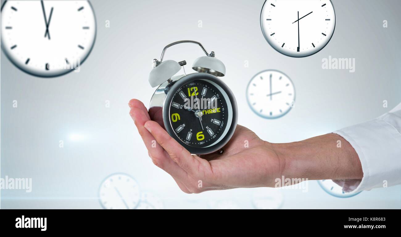 Digital composite of Business man holding a clock against background ...