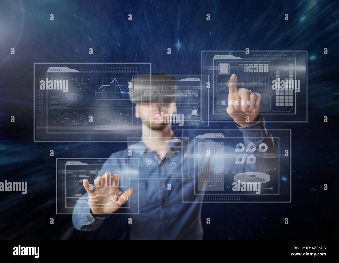 Digital composite of young man using vr headset interface Stock Photo ...