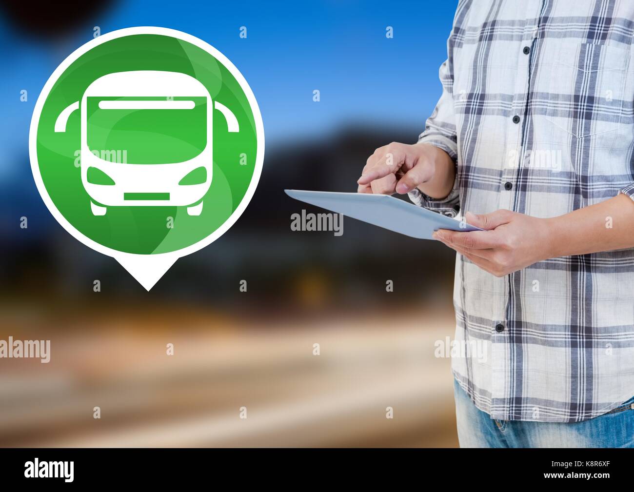 Digital composite of Holding tablet with bus icon by road Stock Photo ...