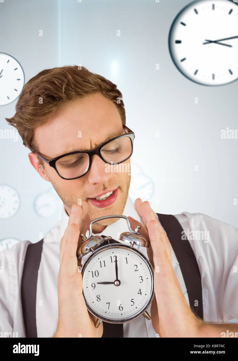 Digital composite of Nerd business man holding a clock against ...