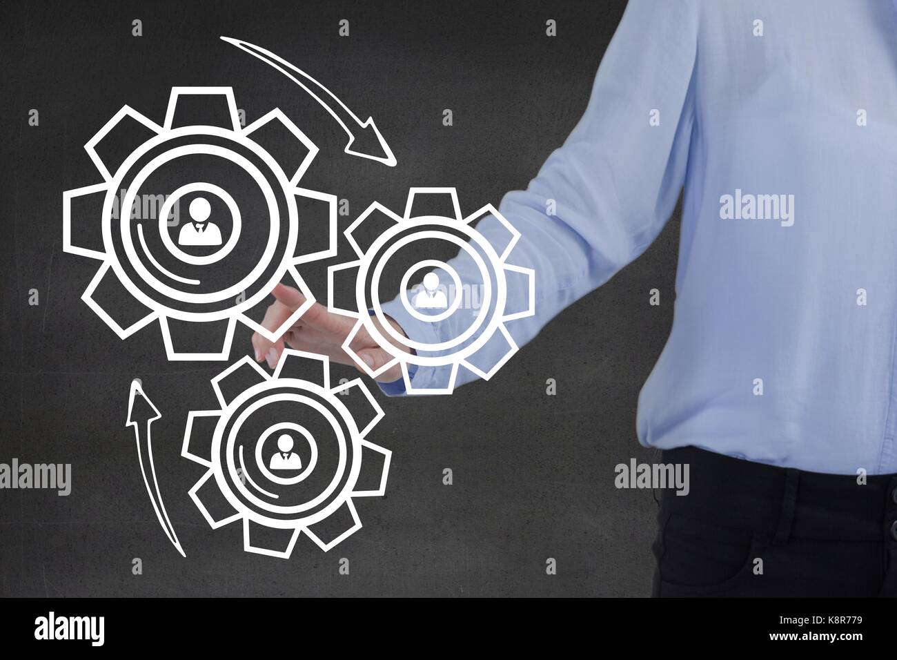 Digital composite of Business woman interacting with people in cogs ...