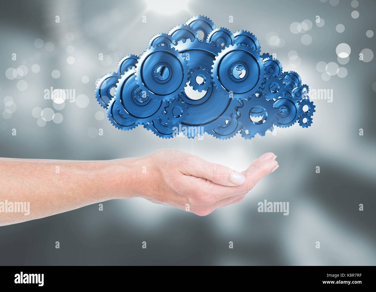 Digital composite of Open hand with cog gears cloud Stock Photo - Alamy