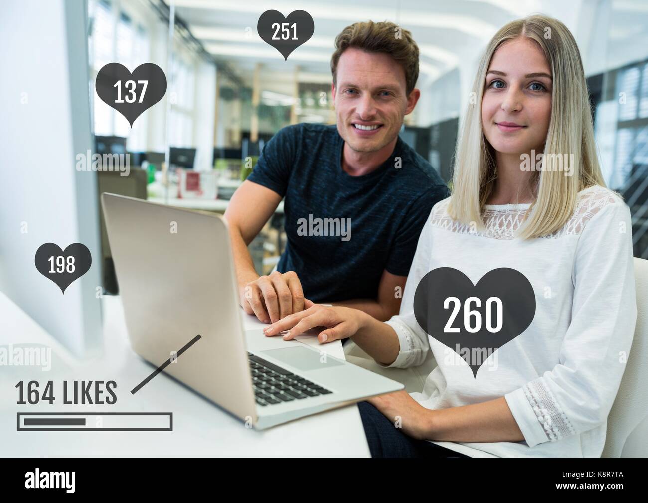 Digital composite of People on computer with likes status bar and ...