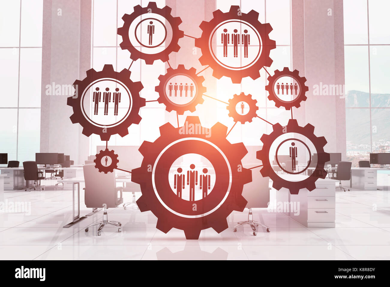 Graphic image of human representations in gears against office ...