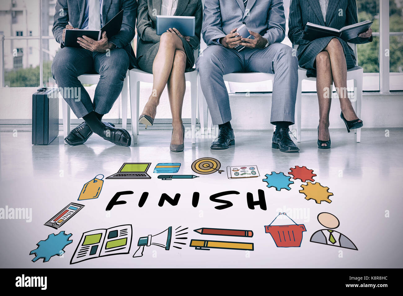 Business people waiting to be called into interview against finish text ...