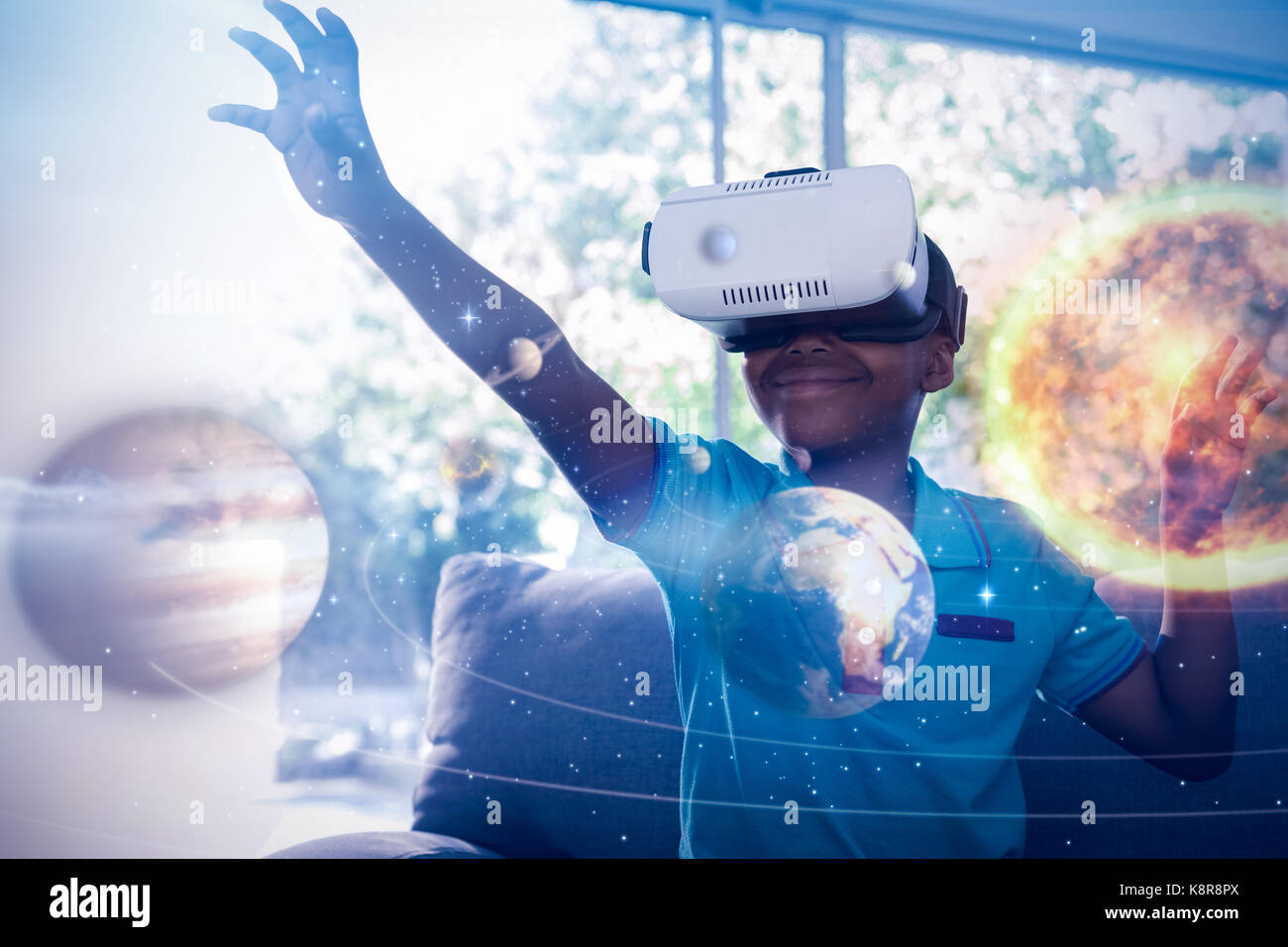Composite image of solar system against white background against boy ...