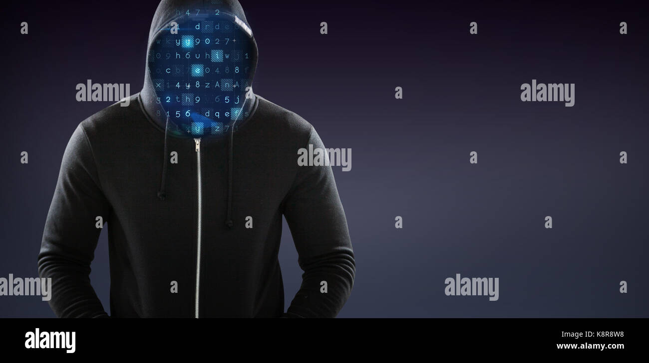 Male hacker in black hoodie standing against gray and purple background ...