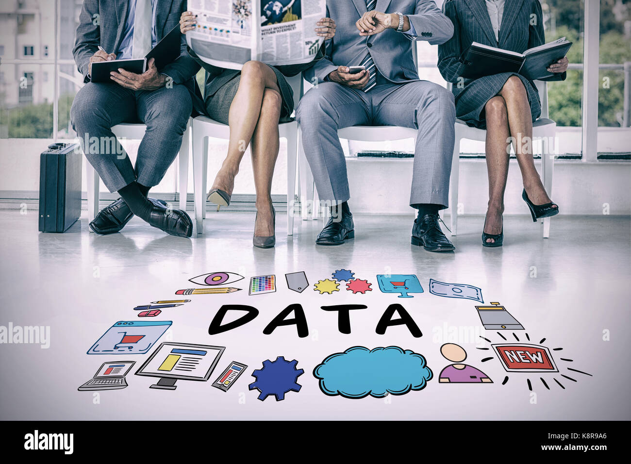 Business people waiting to be called into interview against data text ...