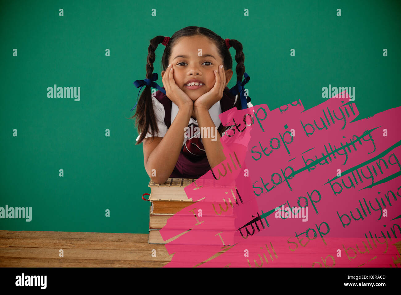 I will stop bullying text on black scribbling against schoolgirl ...