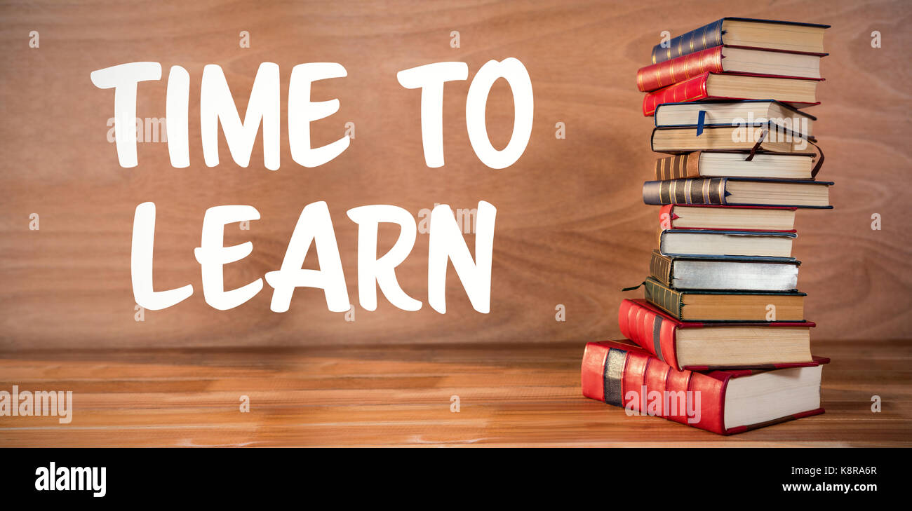 Time to learn text against white background against stack of various ...