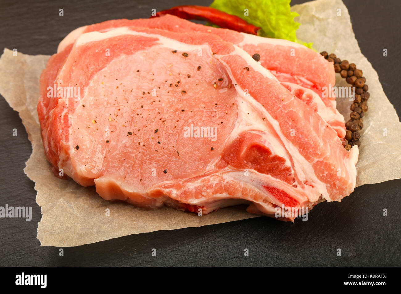 Raw pork cutlet with pepper and salt ready for cooking Stock Photo - Alamy