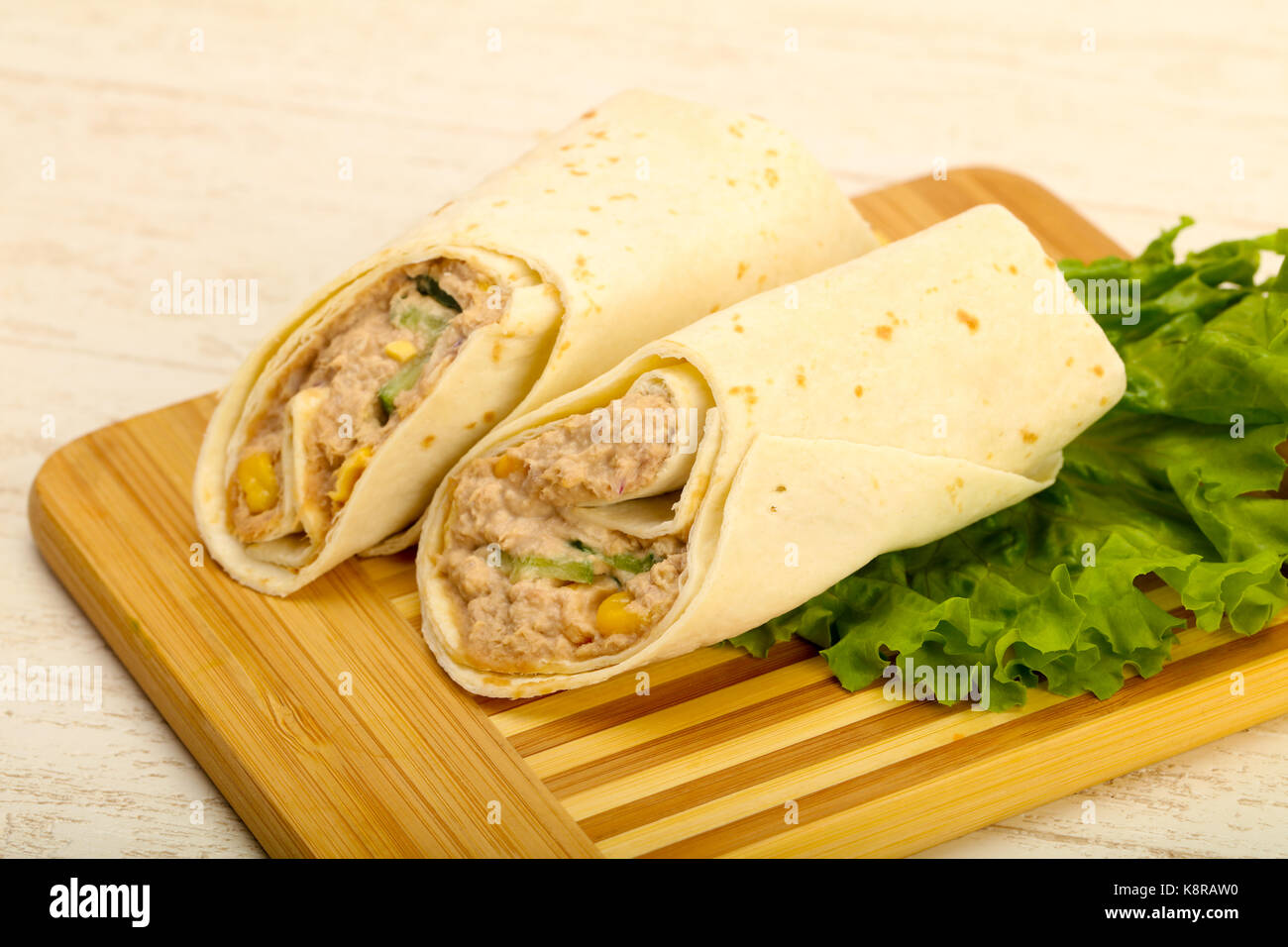 Tuna bread roll with salad leaves Stock Photo - Alamy