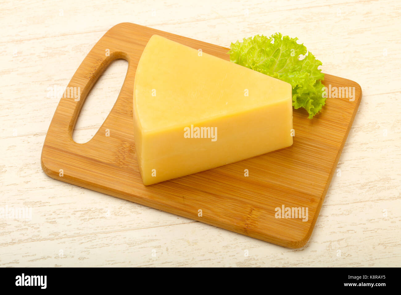 Parmesan cheese triangle Stock Photo - Alamy