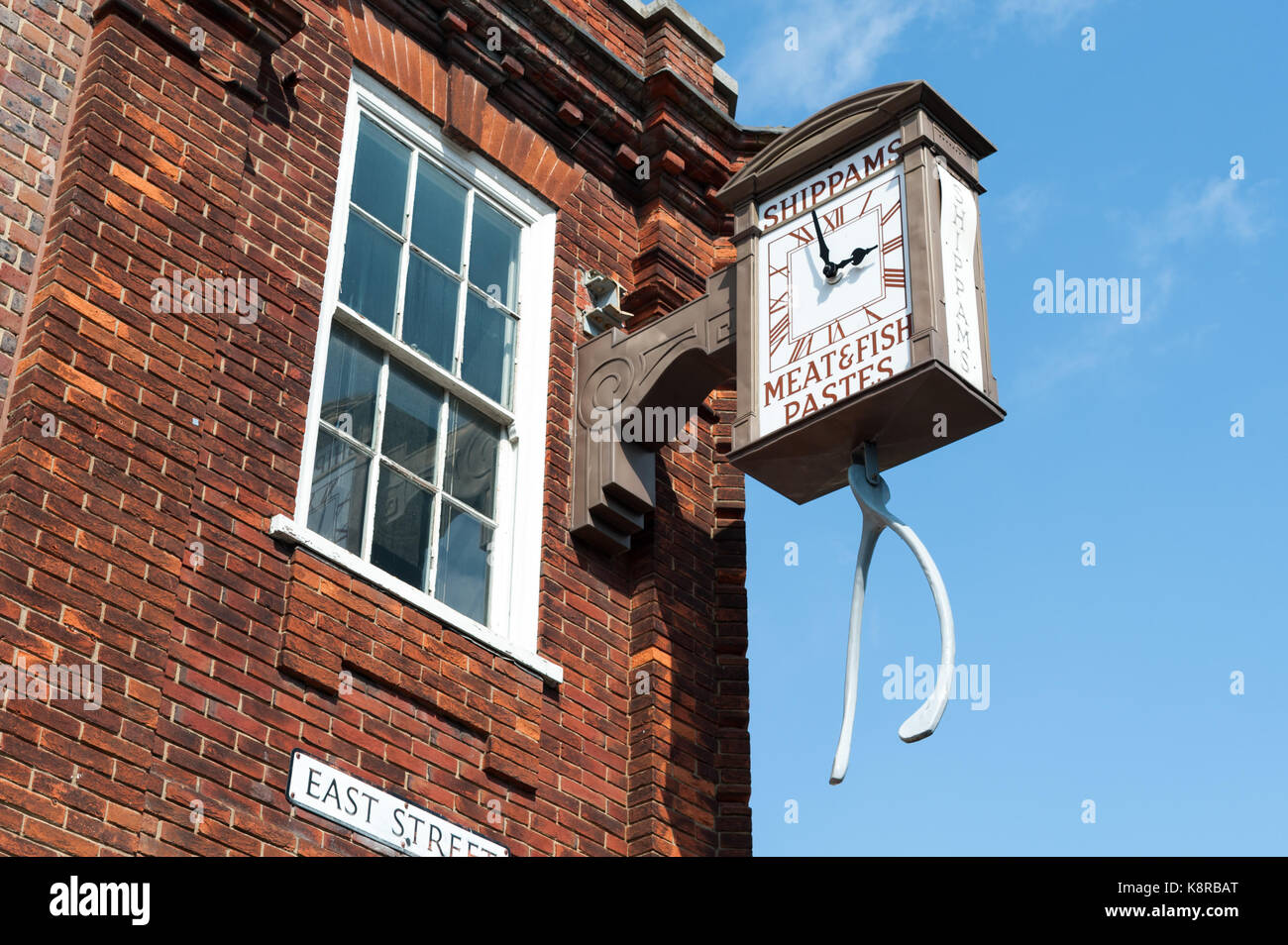An Old Clock Sponsored By Shippams An English Food Brand On The Exterior Of A Building In East an-old-clock-sponsored-by-shippams-an-english-food-brand-on-the-exterior-of-a-building-in-east