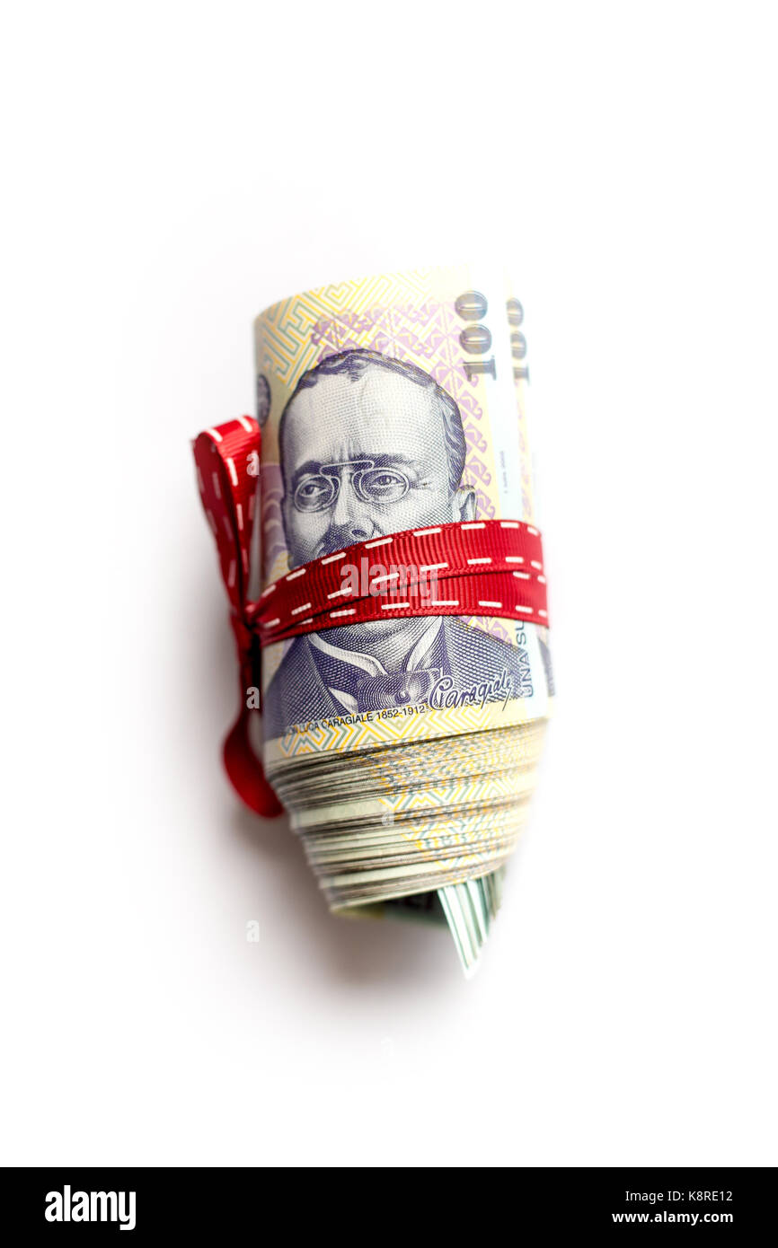 Roll of money isolated on white background with red ribbon, Romanian ...
