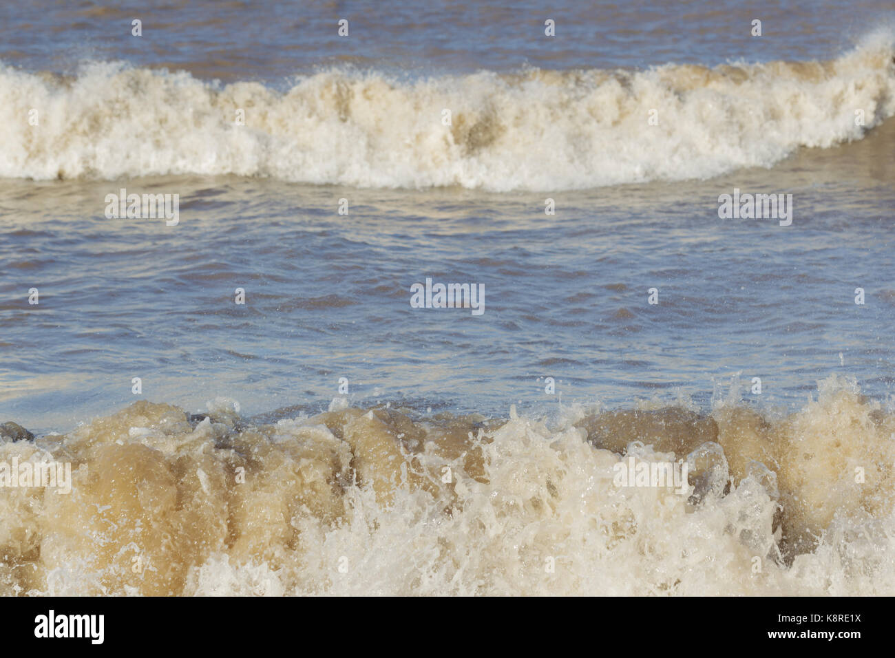 Breaking waves on North Sea, Withernsea beach, East Yorkshire, England ...