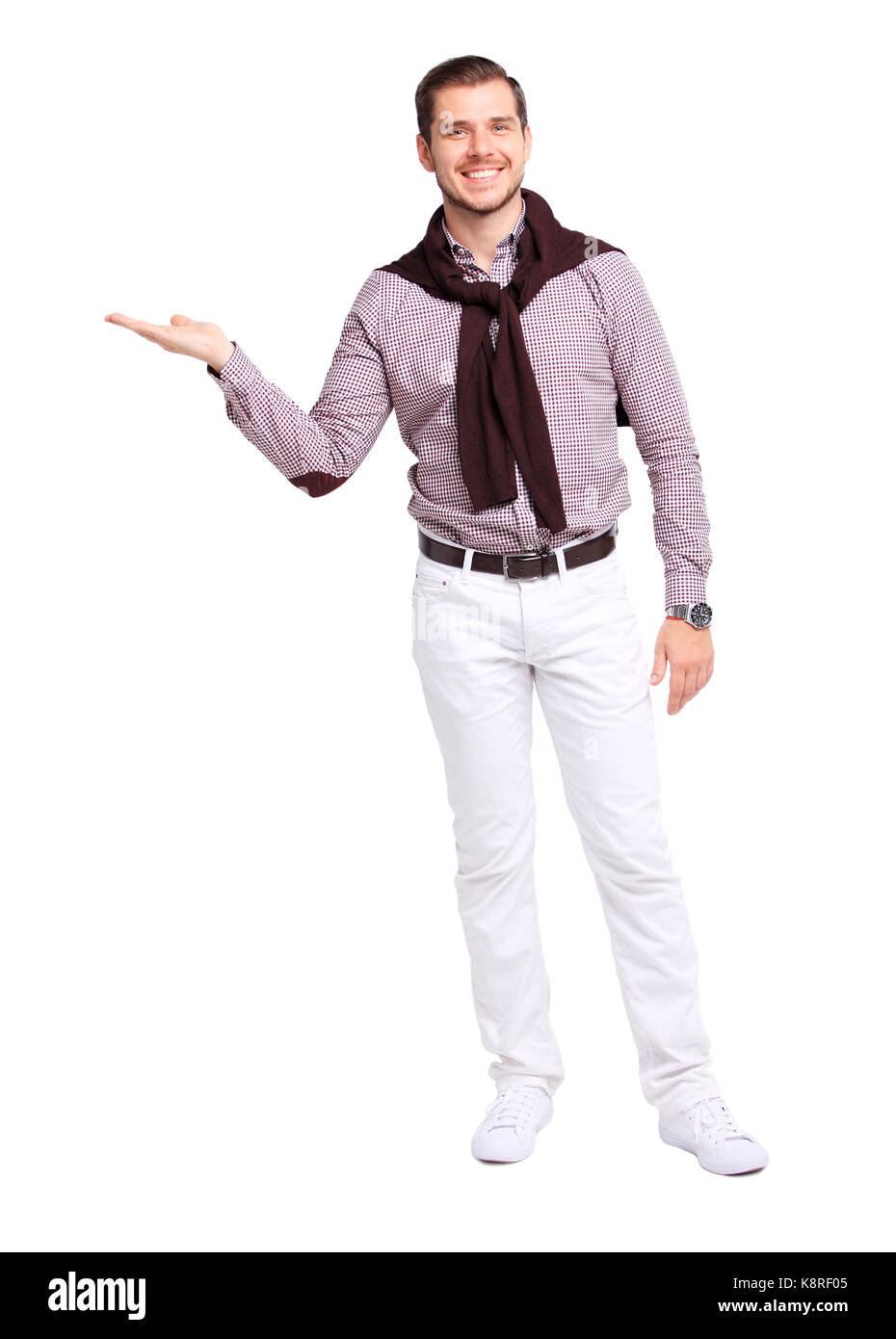 Happy smiling young man presenting and showing your text or product ...