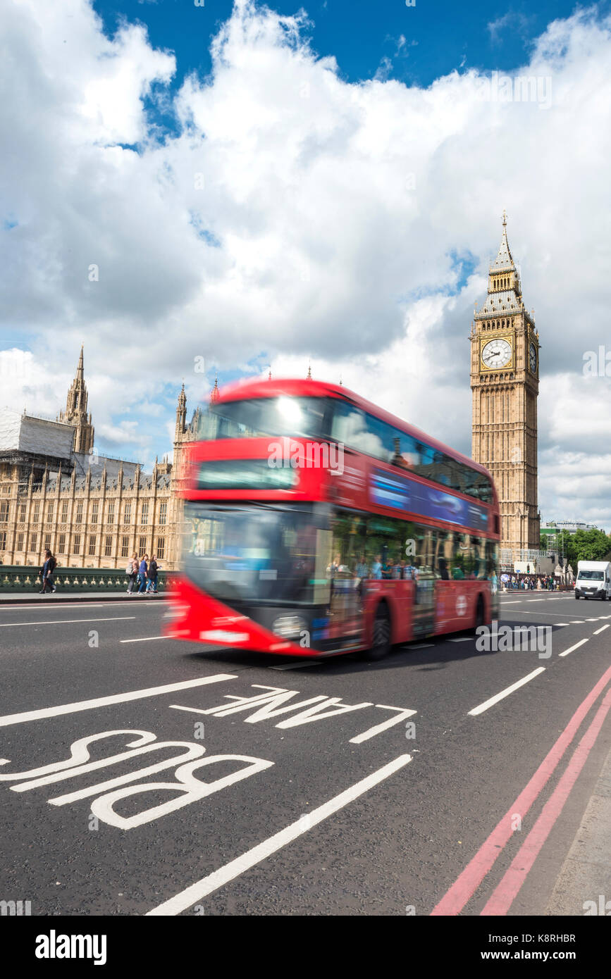 Red double-decker bus on the Westminster Bridge, motion blur ...