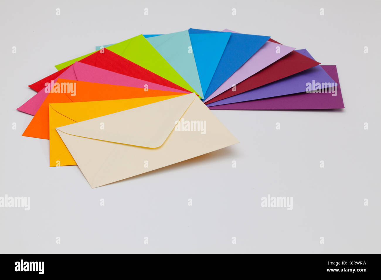 Different colored envelopes on the table Stock Photo - Alamy
