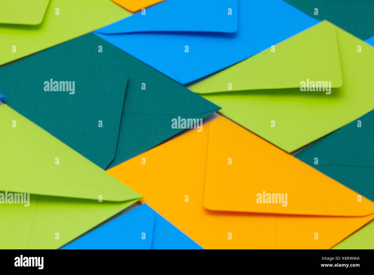 Different colored envelopes on the table Stock Photo - Alamy