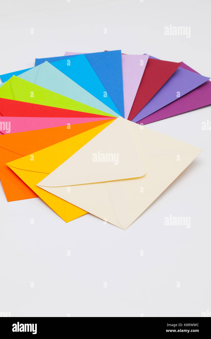 Different colored envelopes on the table Stock Photo - Alamy
