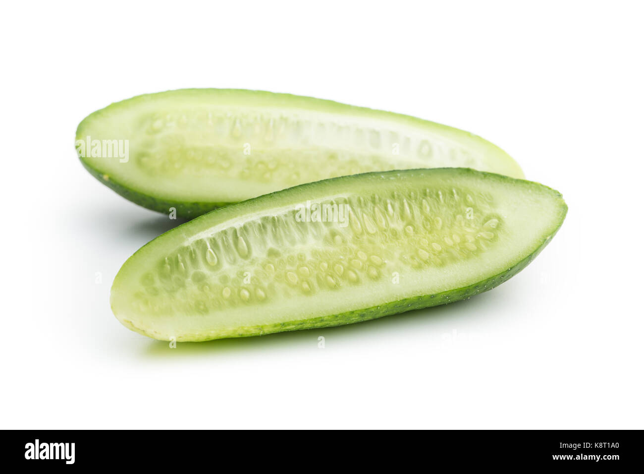Fresh sliced cucumber isolated on white background. One sliced cucumber ...