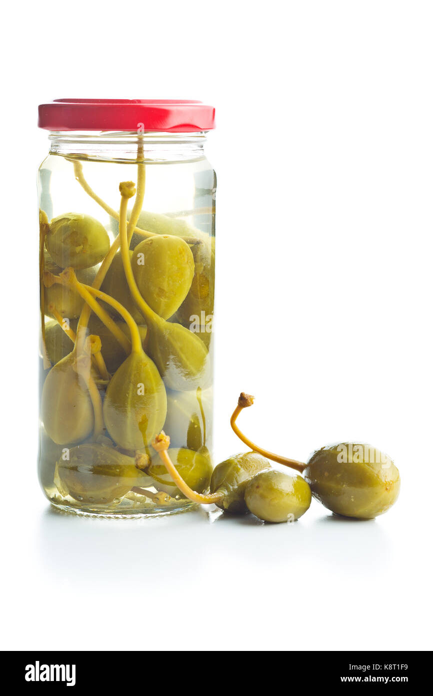 Pickled caper berries in jar isolated on white background Stock Photo ...