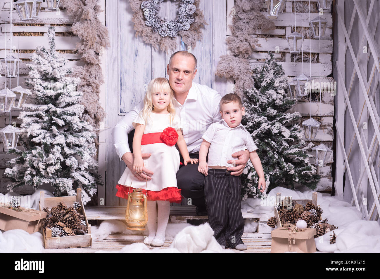 Father with children at Christmas Stock Photo - Alamy