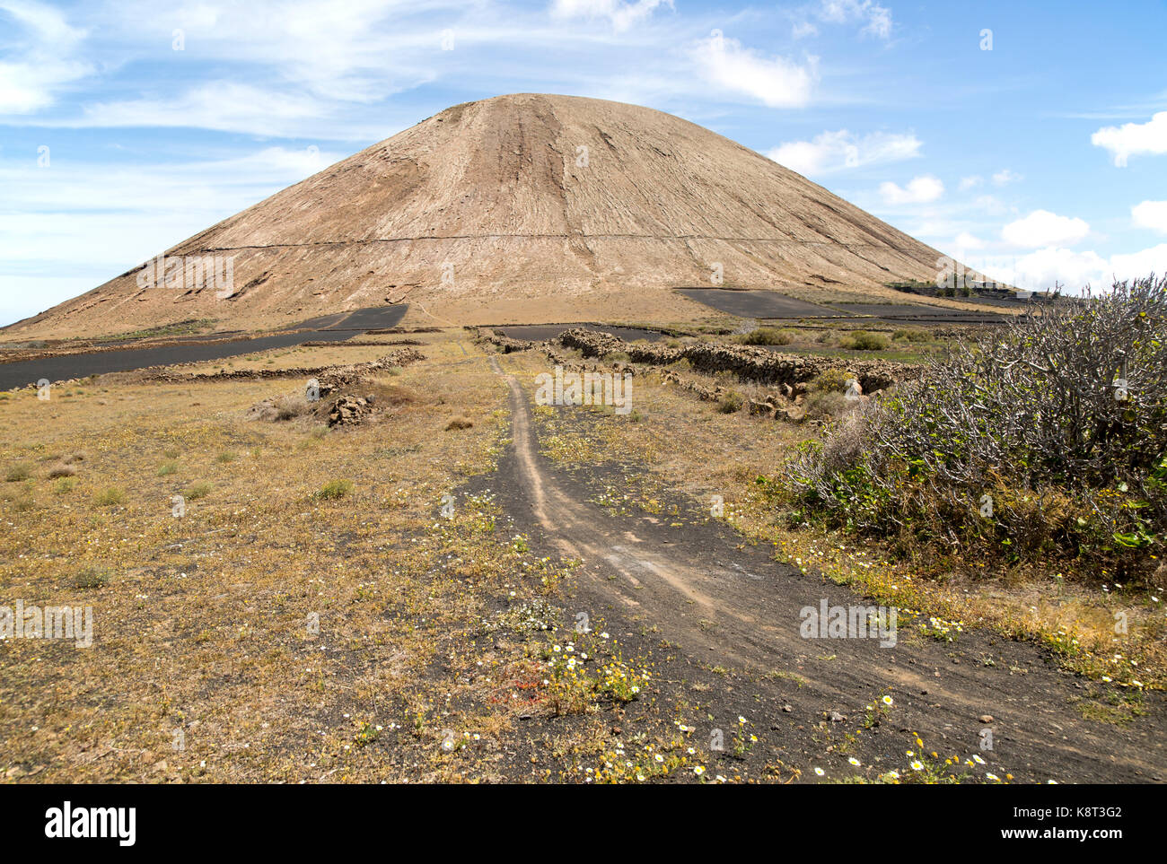Volcano cone and black volcanic soil farmland hi-res stock photography ...
