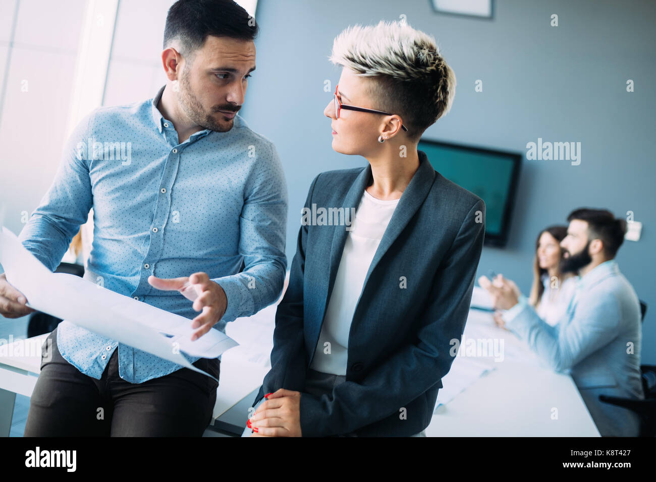 Portrait of architects having discussion in office Stock Photo - Alamy