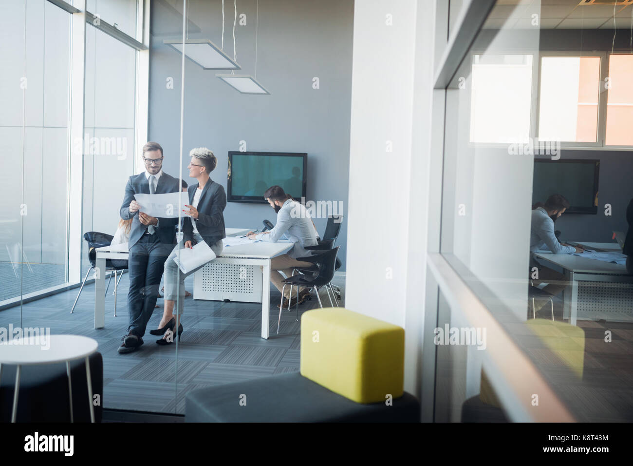 Portrait of architects having discussion in office Stock Photo - Alamy