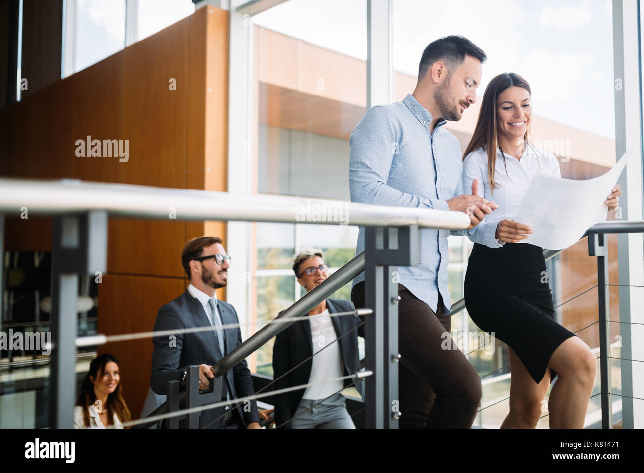 Picture of architects talking about project in hall Stock Photo - Alamy