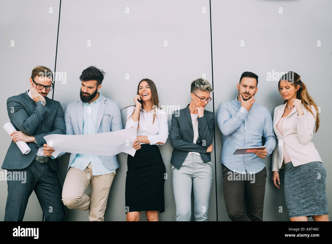 Group of perspective designers discussing in office Stock Photo - Alamy