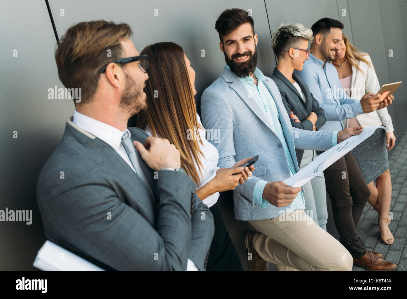 Group of perspective designers discussing in office Stock Photo - Alamy