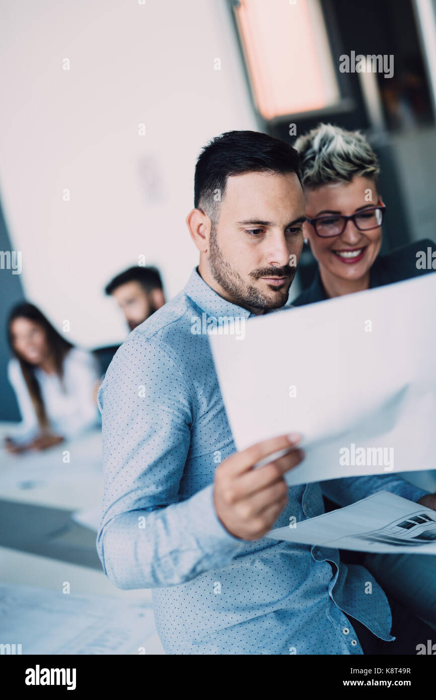 Group of perspective designers discussing in office Stock Photo - Alamy