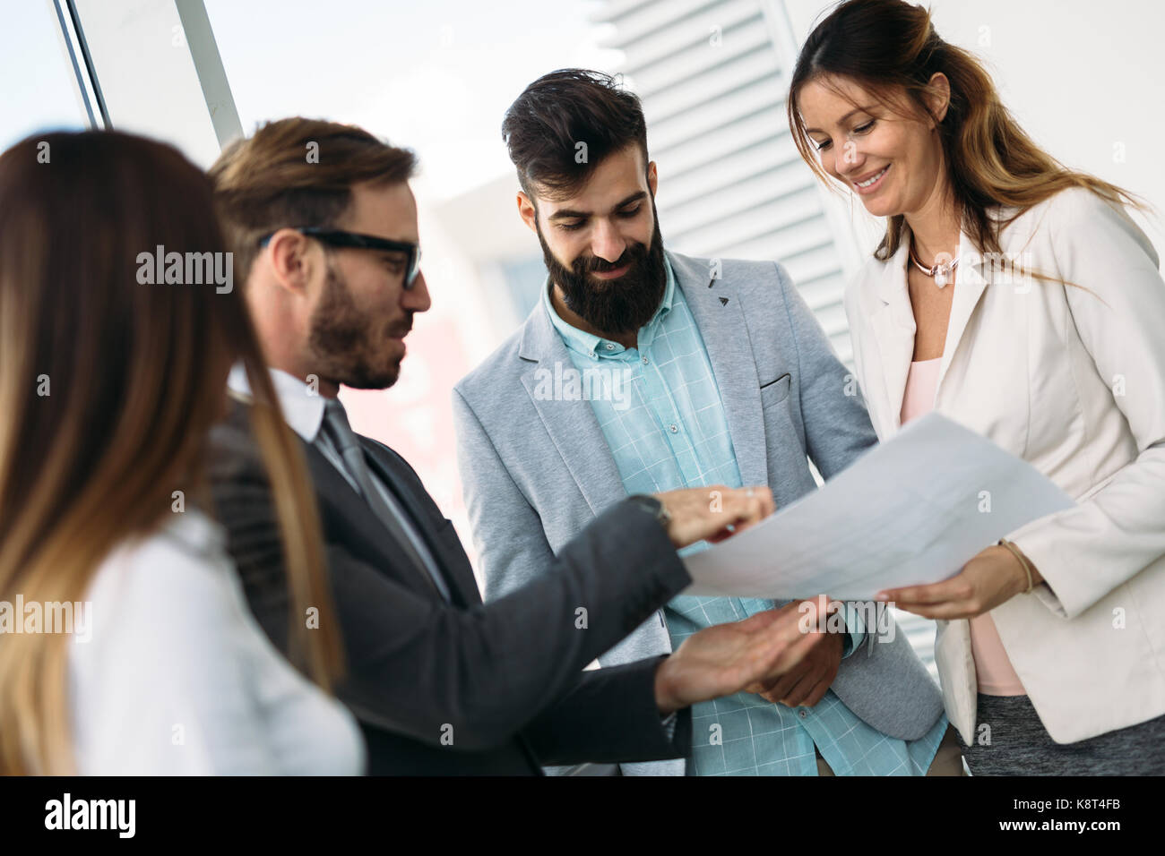 Team of architects working on construction plans Stock Photo - Alamy