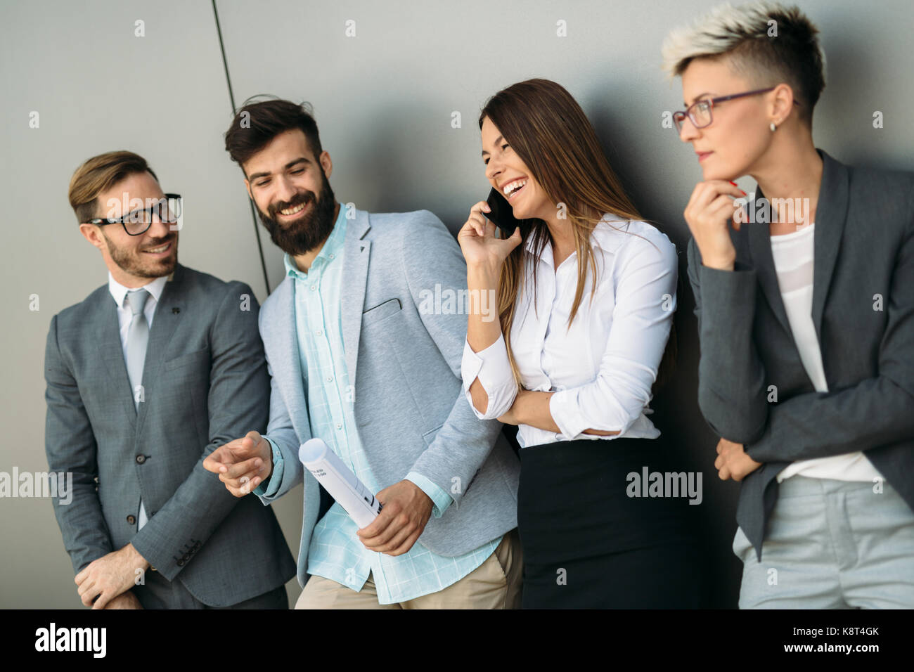 Group of perspective designers discussing in office Stock Photo - Alamy