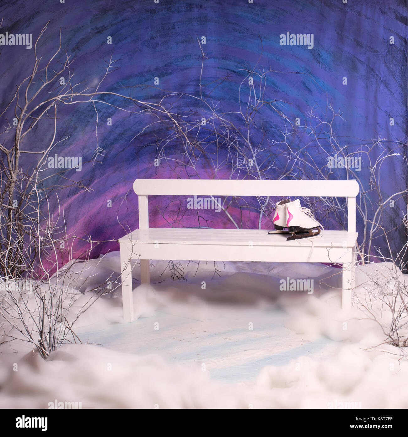 Ice skates on white bench Stock Photo - Alamy