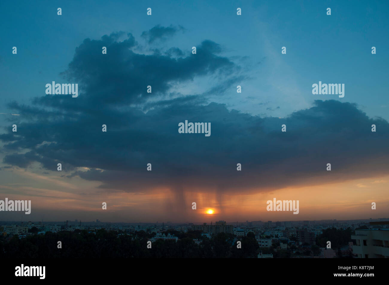 Cloud Burst Rain Over City Stock Photo - Alamy