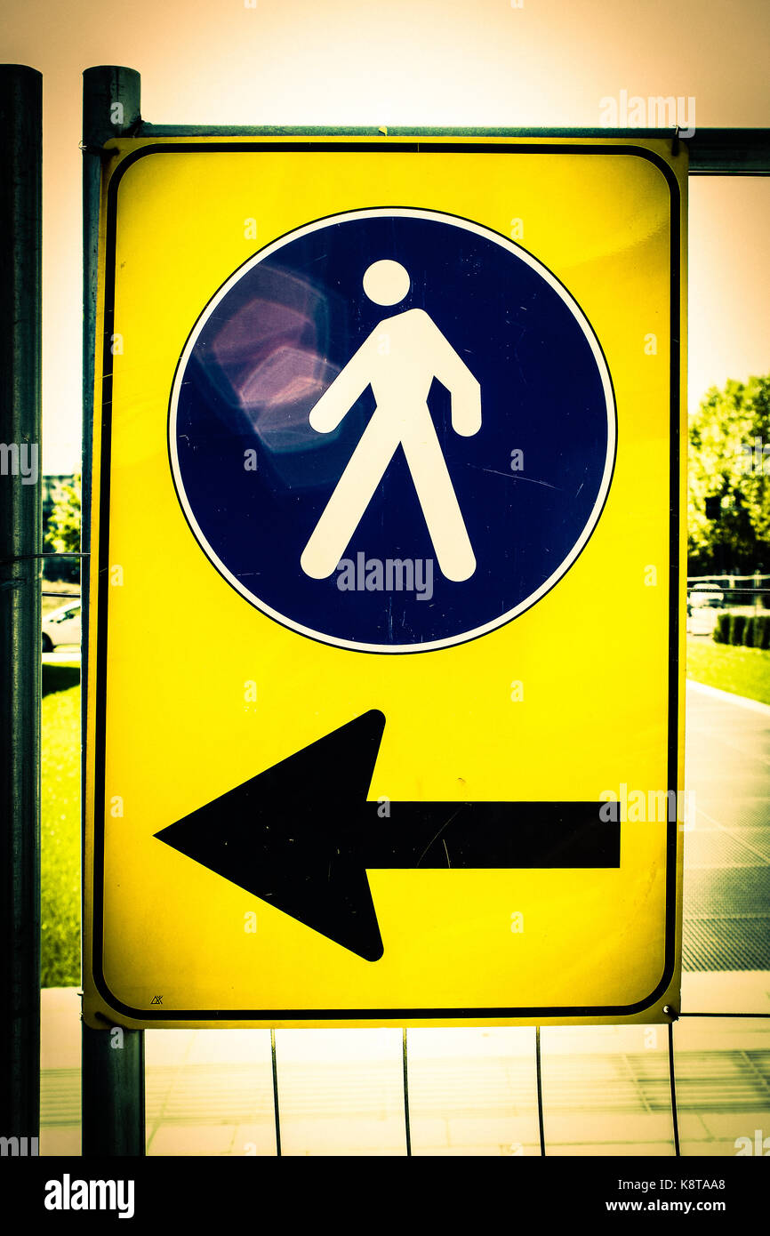 pedestrian blue and yellow street sign Stock Photo - Alamy
