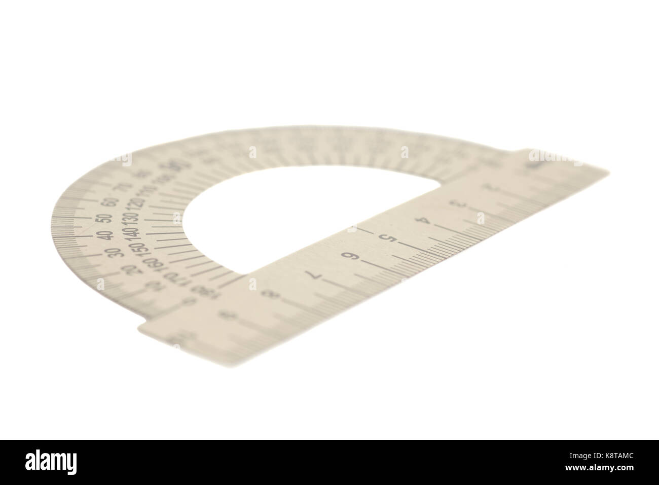 Metal protractor isolated on white background Stock Photo - Alamy