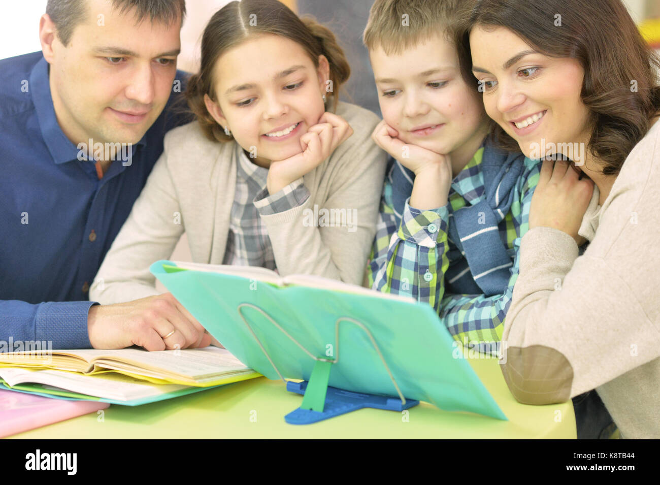 Adults helping children hi-res stock photography and images - Alamy