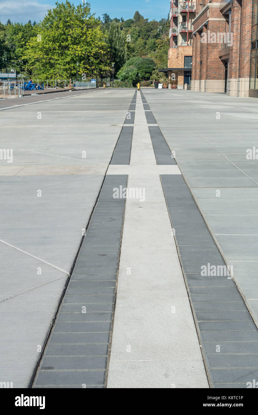 A view of a cement walkway on the shore of Lake Washington in Renton ...