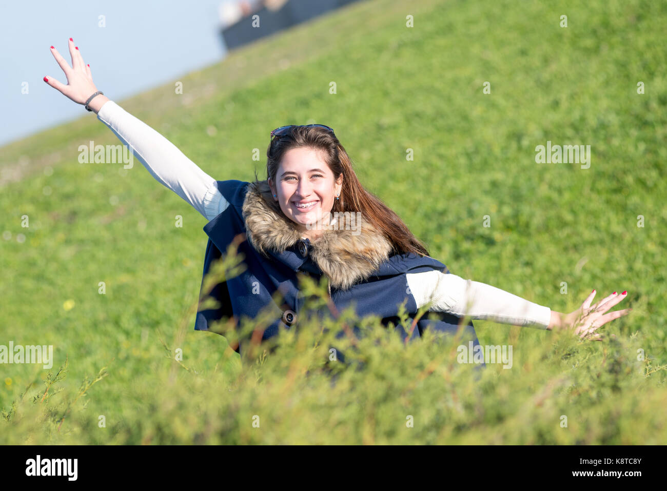 Beautiful and happy young girl posing outdoors Stock Photo - Alamy