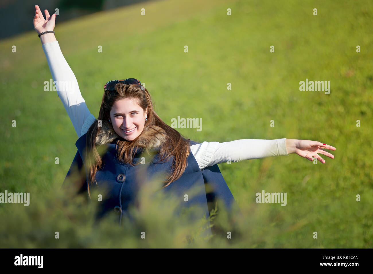 Beautiful and happy young girl posing outdoors Stock Photo - Alamy