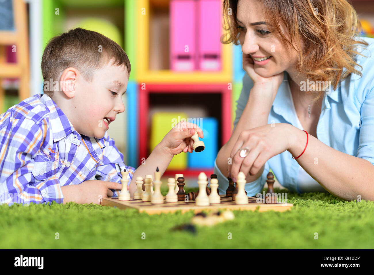 Beautiful young mother playing with her cute little son Stock Photo - Alamy