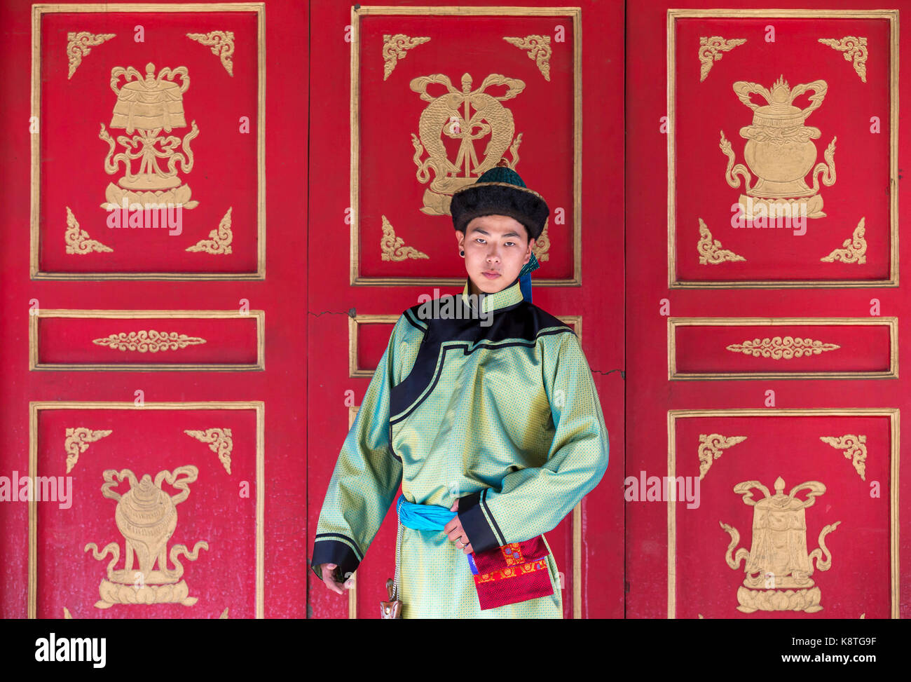 mongolian man in traditional outfit near old Temple in Ulaanbaatar ...