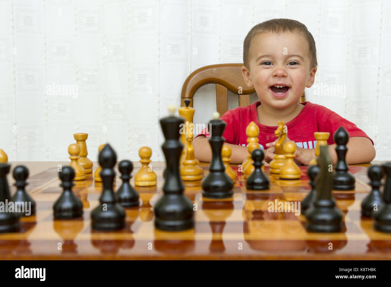 Little boy playing chess Stock Photo - Alamy