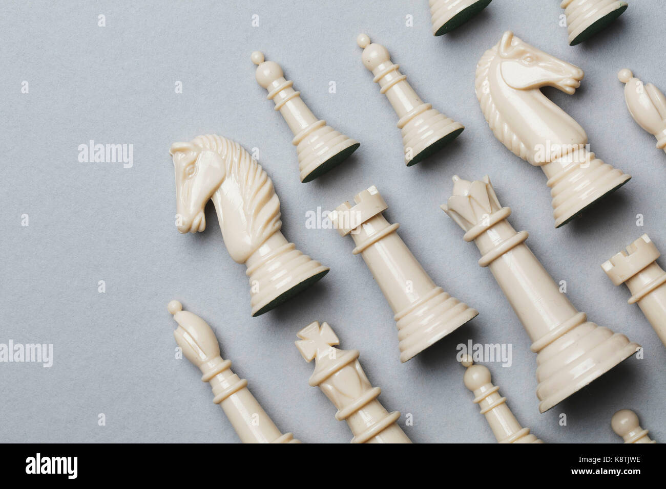 Chess game pieces on a grey background. Strategy concept Stock Photo ...